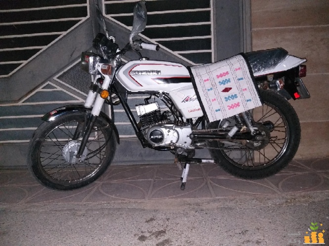 سوزوکی ax100